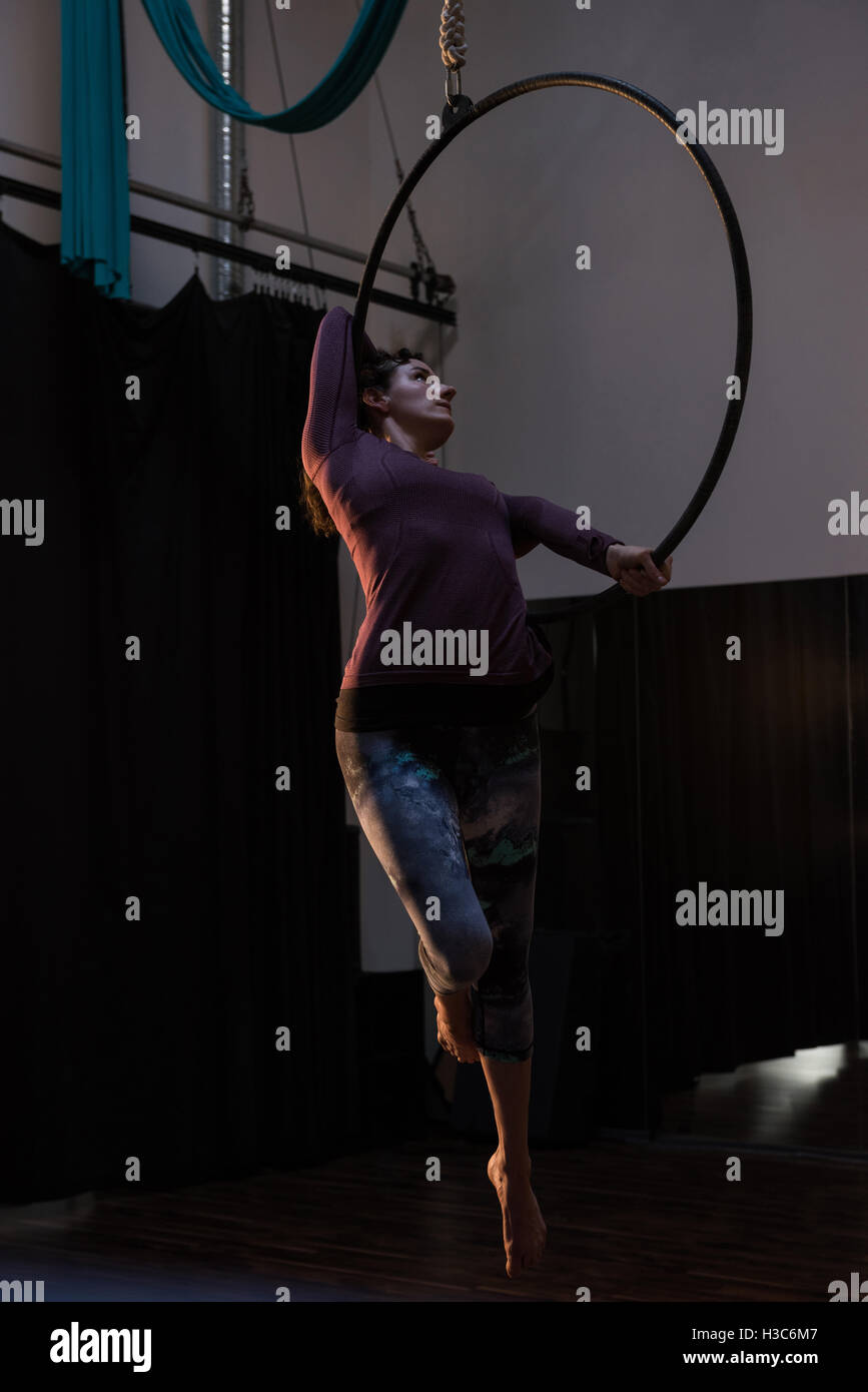 Gymnast performing gymnastics on hoop Stock Photo - Alamy