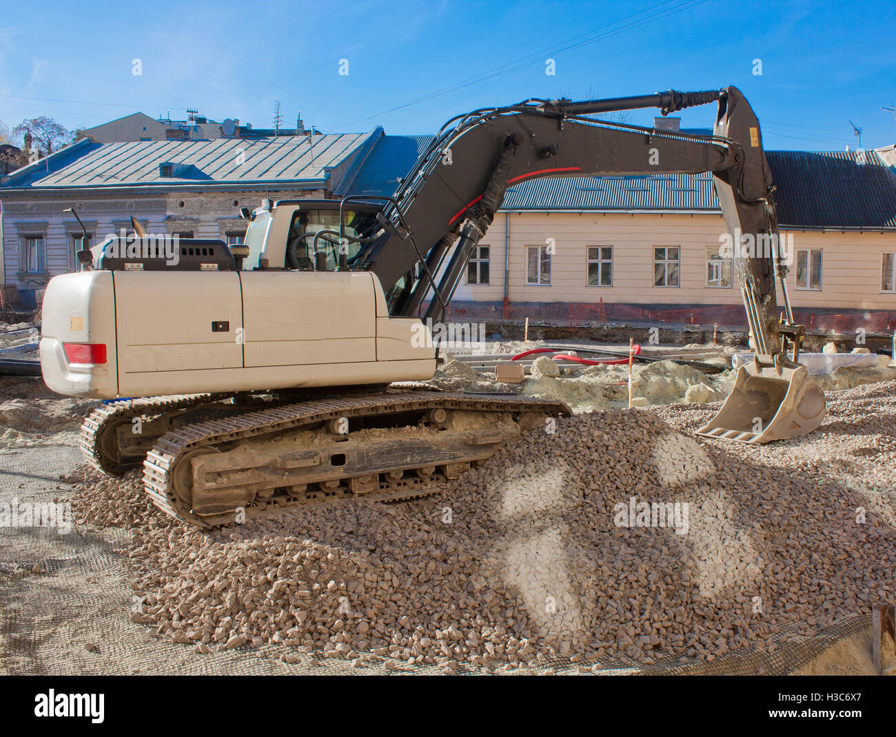 excavator doing roadworks Stock Photo - Alamy