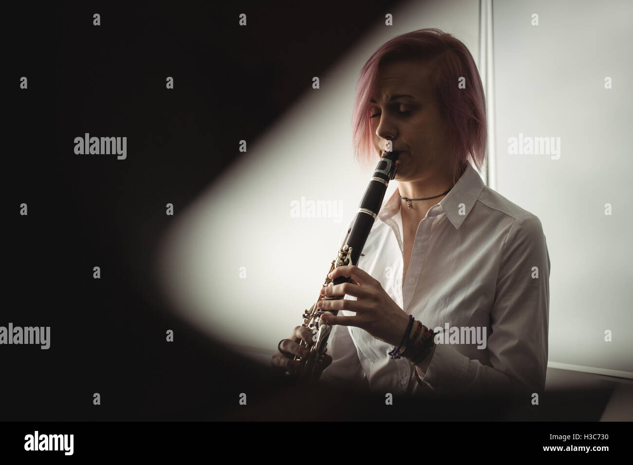 Woman playing a clarinet in music school Stock Photo - Alamy