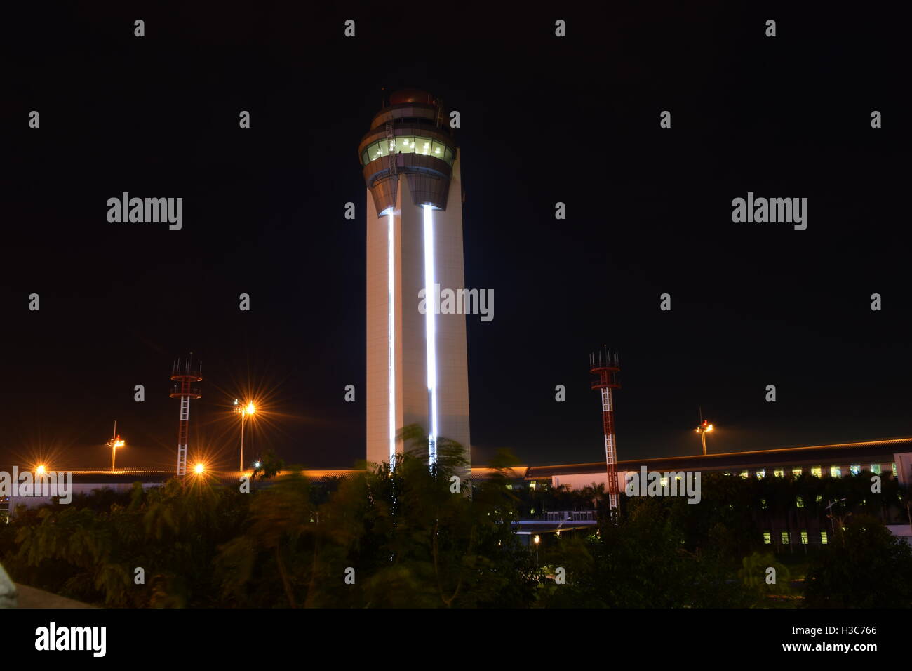 modern airport control tower at night with light Stock Photo - Alamy