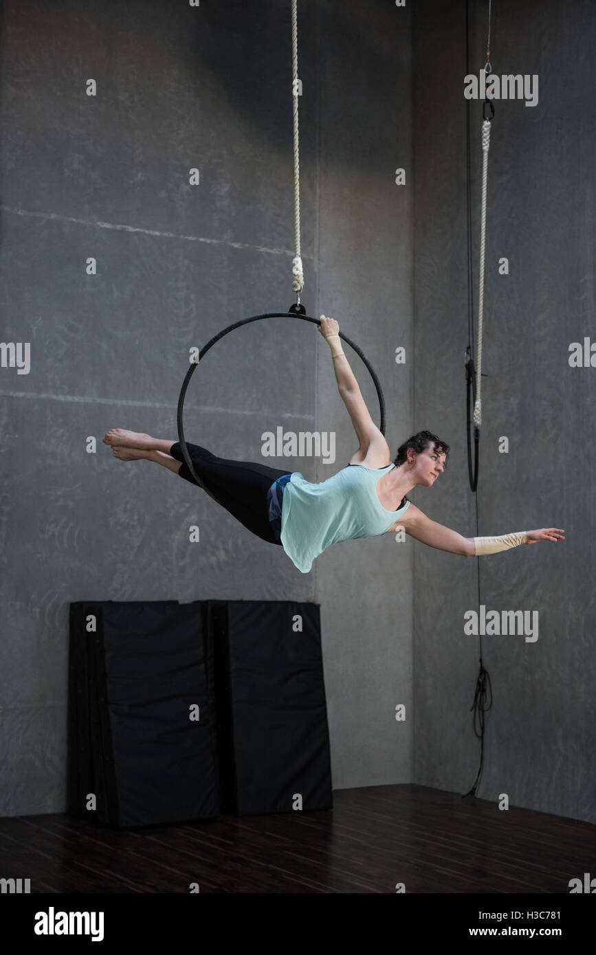 Gymnast performing gymnastics on hoop Stock Photo - Alamy