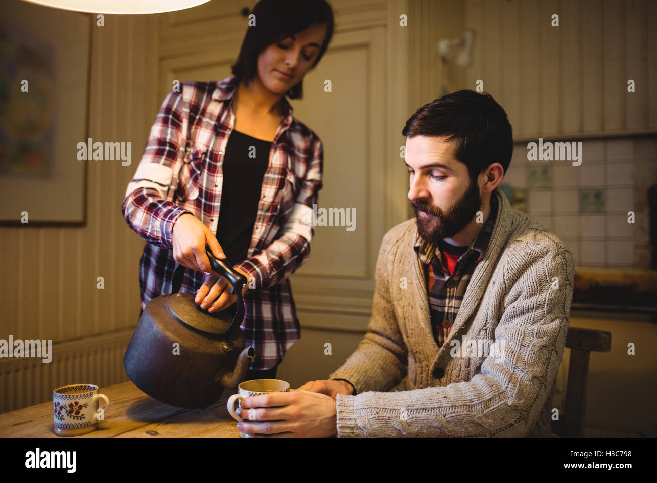 Beautiful woman pouring tea hi-res stock photography and images - Alamy