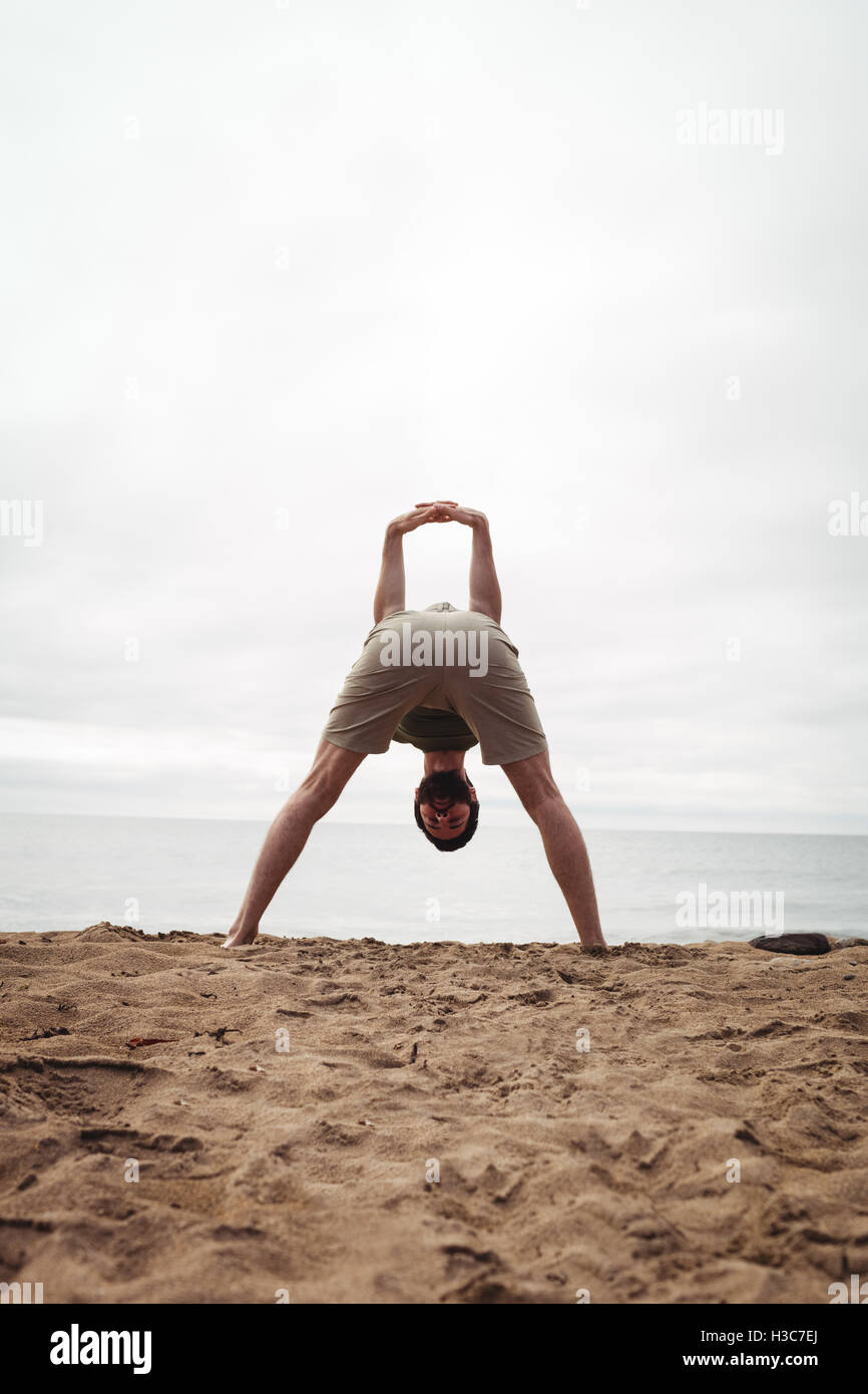 Man performing stretching exercise Stock Photo - Alamy