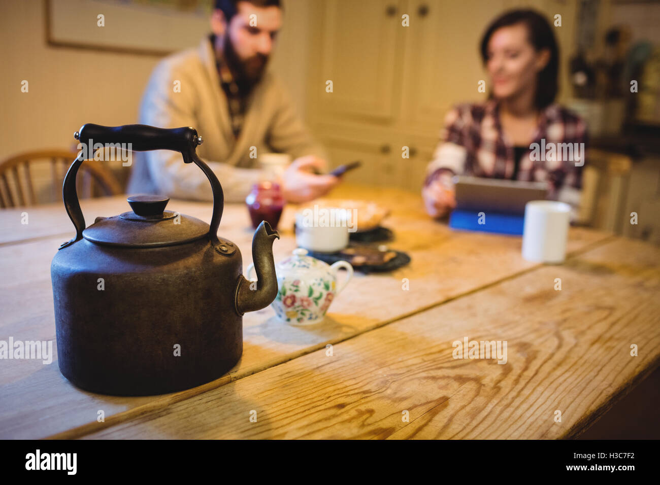 Teapot on a table Stock Photo - Alamy