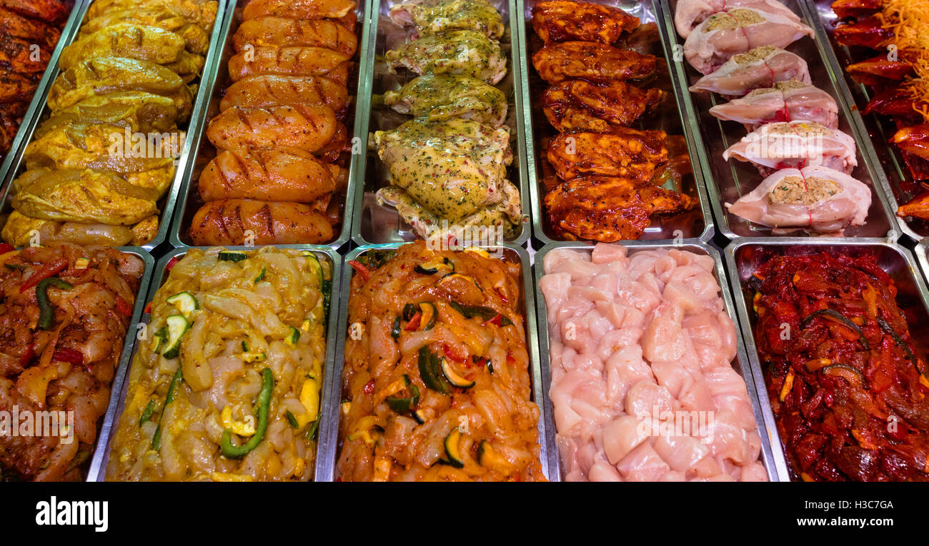 Variety of marinated meat at display counter Stock Photo - Alamy
