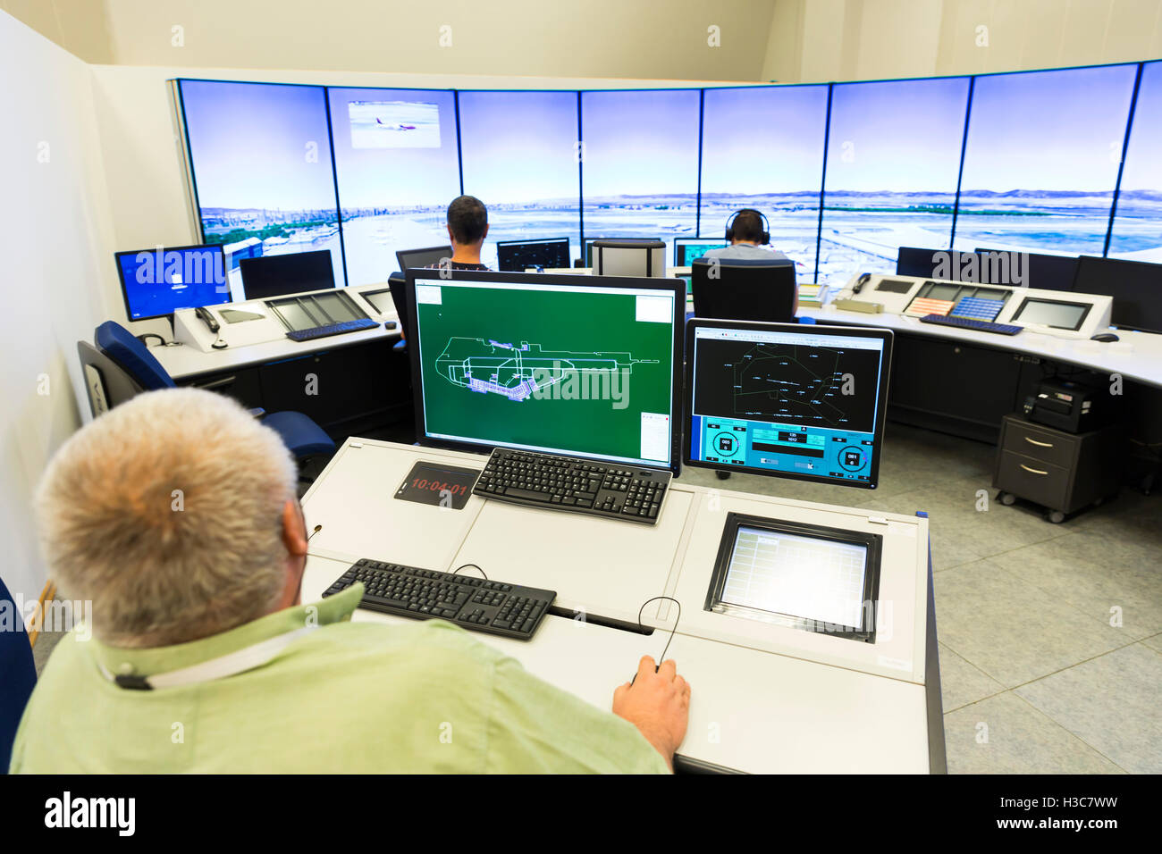 An air traffic controller is directing flights during a wo hi-res stock ...