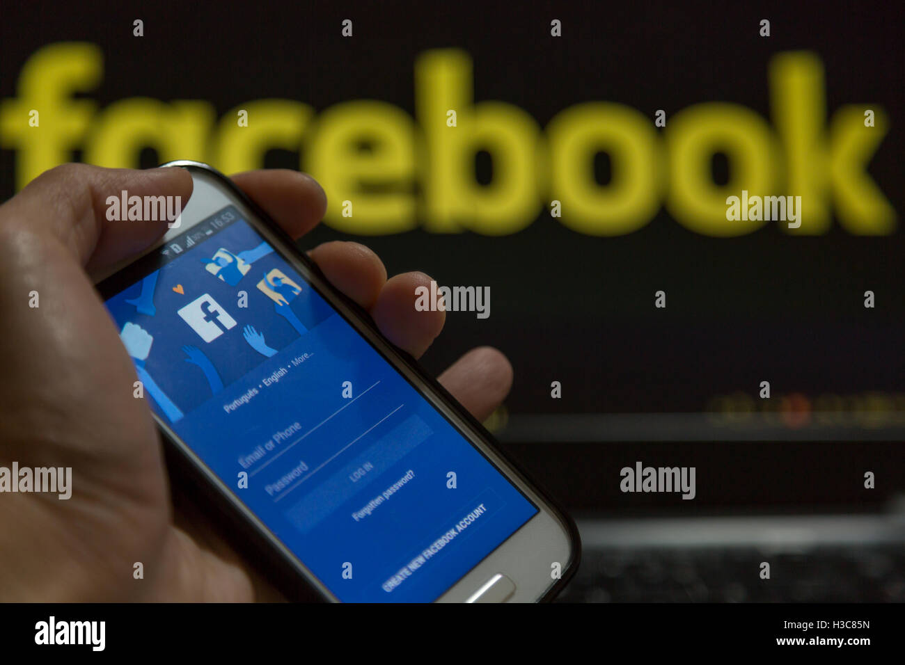 A smartphone display shows Facebook application Stock Photo - Alamy
