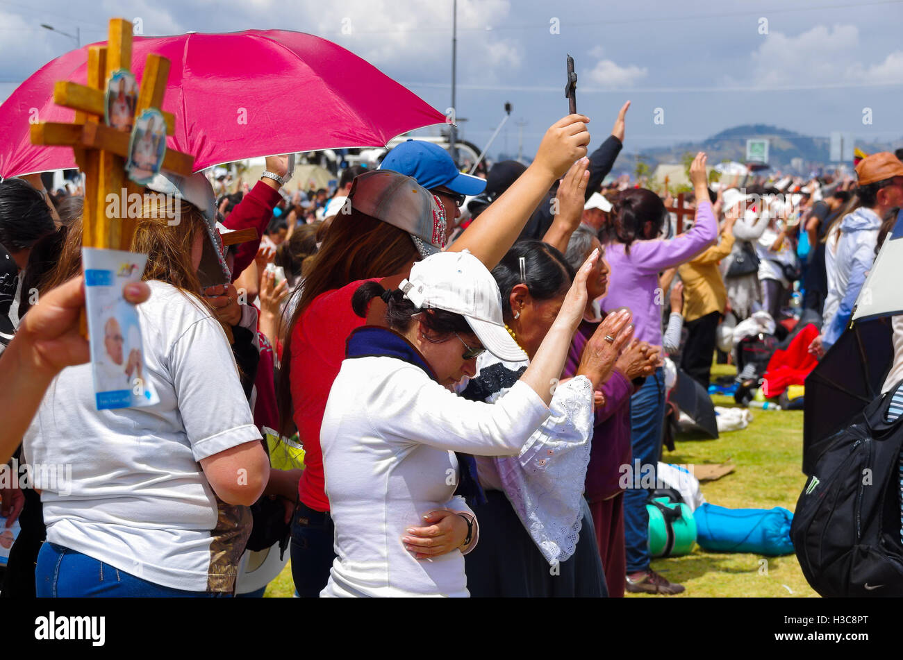 QUITO, ECUADOR - JULY 7, 2015: People raising her hands to receive pope ...