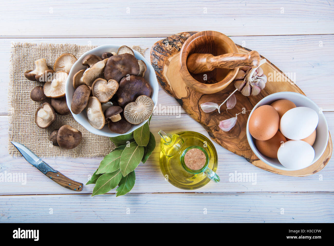 King trumpet mushrooms and ingredients for cooking on the table of the ...