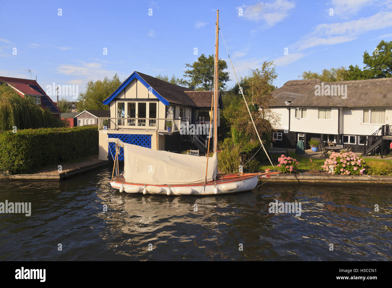 Small Sailing Boat moored on the river banks on the Norfolk Broads ...