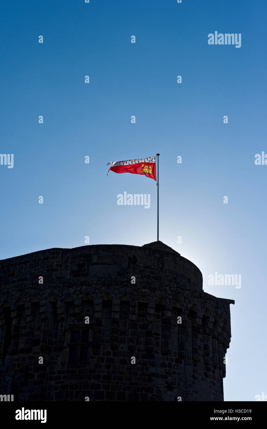 Silhouetted tower with flag pole and Dinan city flag Stock Photo - Alamy