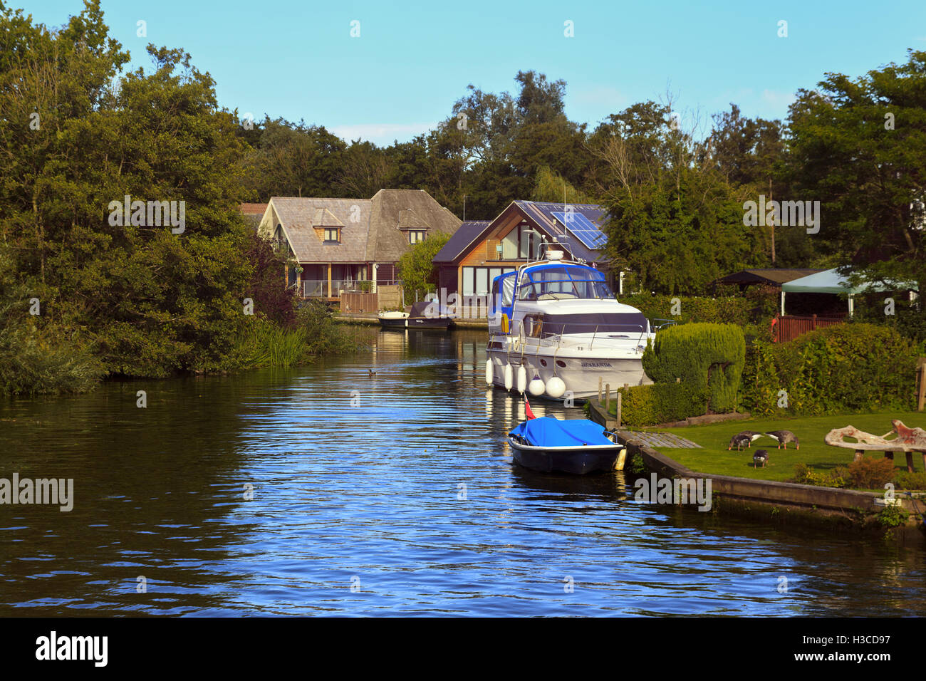 Lodges with boat moorings up a Small Creek off the River Bure on the ...