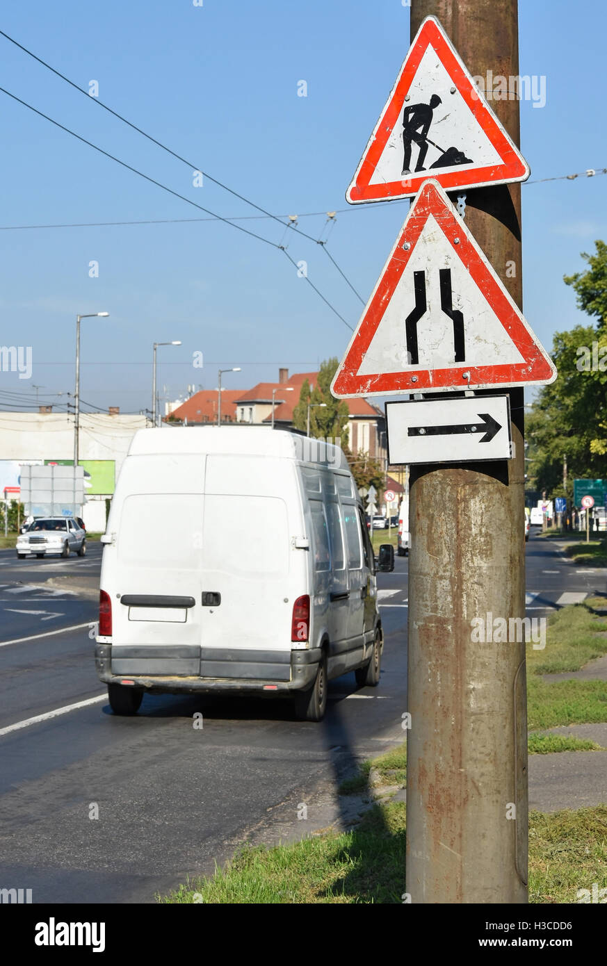 Road works and bottleneck traffic signs on the road Stock Photo - Alamy