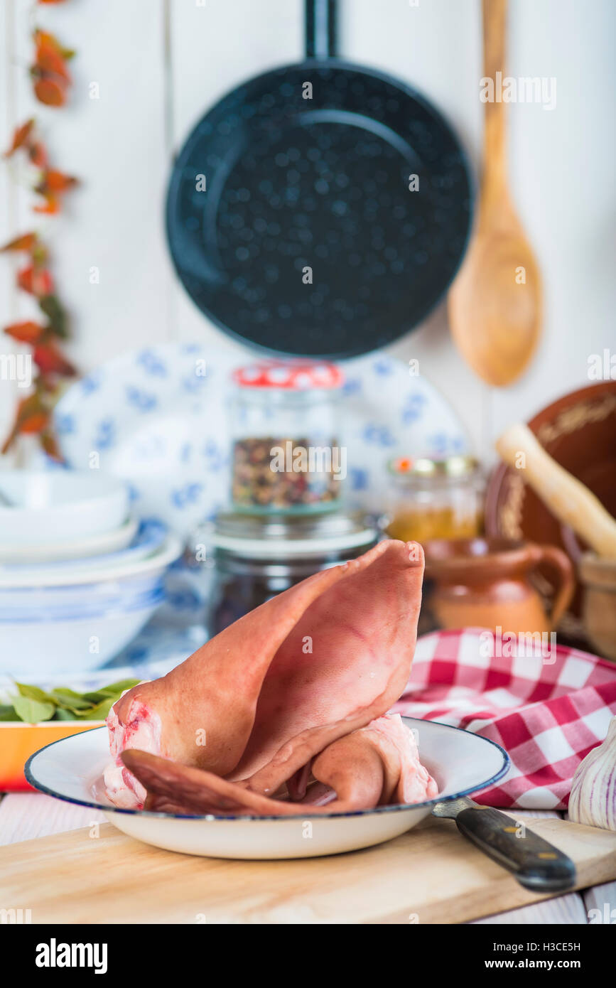Raw and fresh pig ears for cooking on the table of the kitchen Stock ...