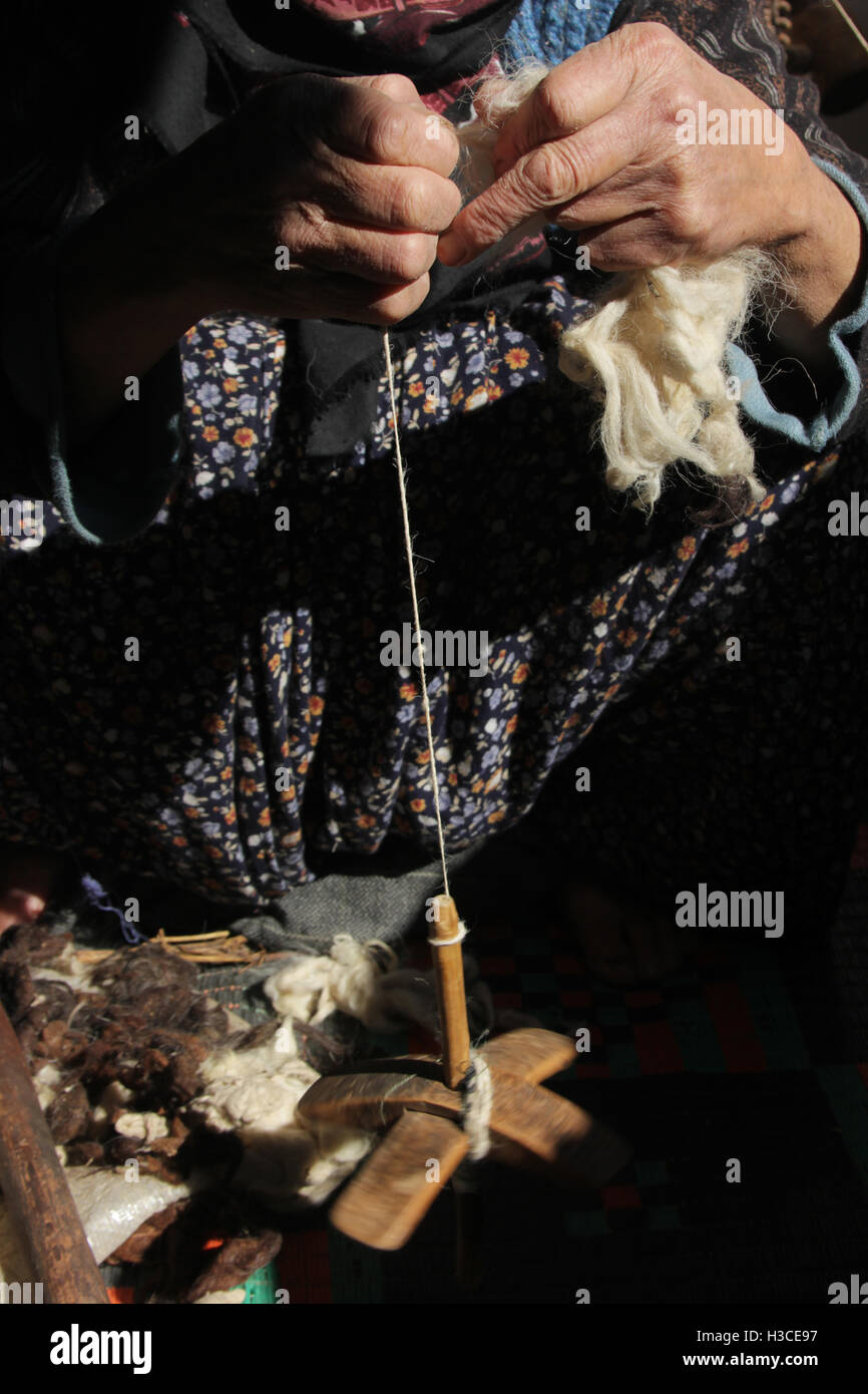 Women spinning wool Stock Photo - Alamy