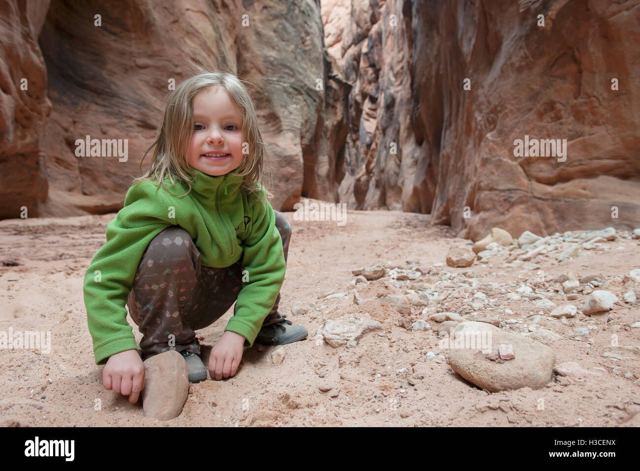 Girl looking at rocks, portrait Stock Photo - Alamy