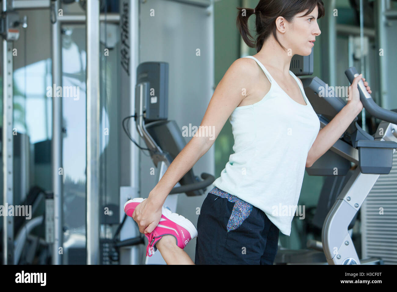 Woman stretches working out hi-res stock photography and images - Alamy