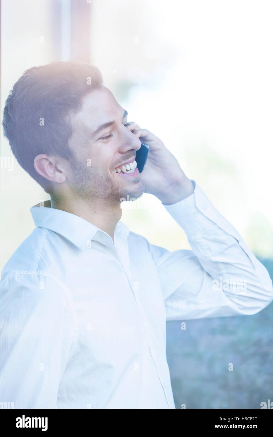 Young professional man receiving call hi-res stock photography and ...