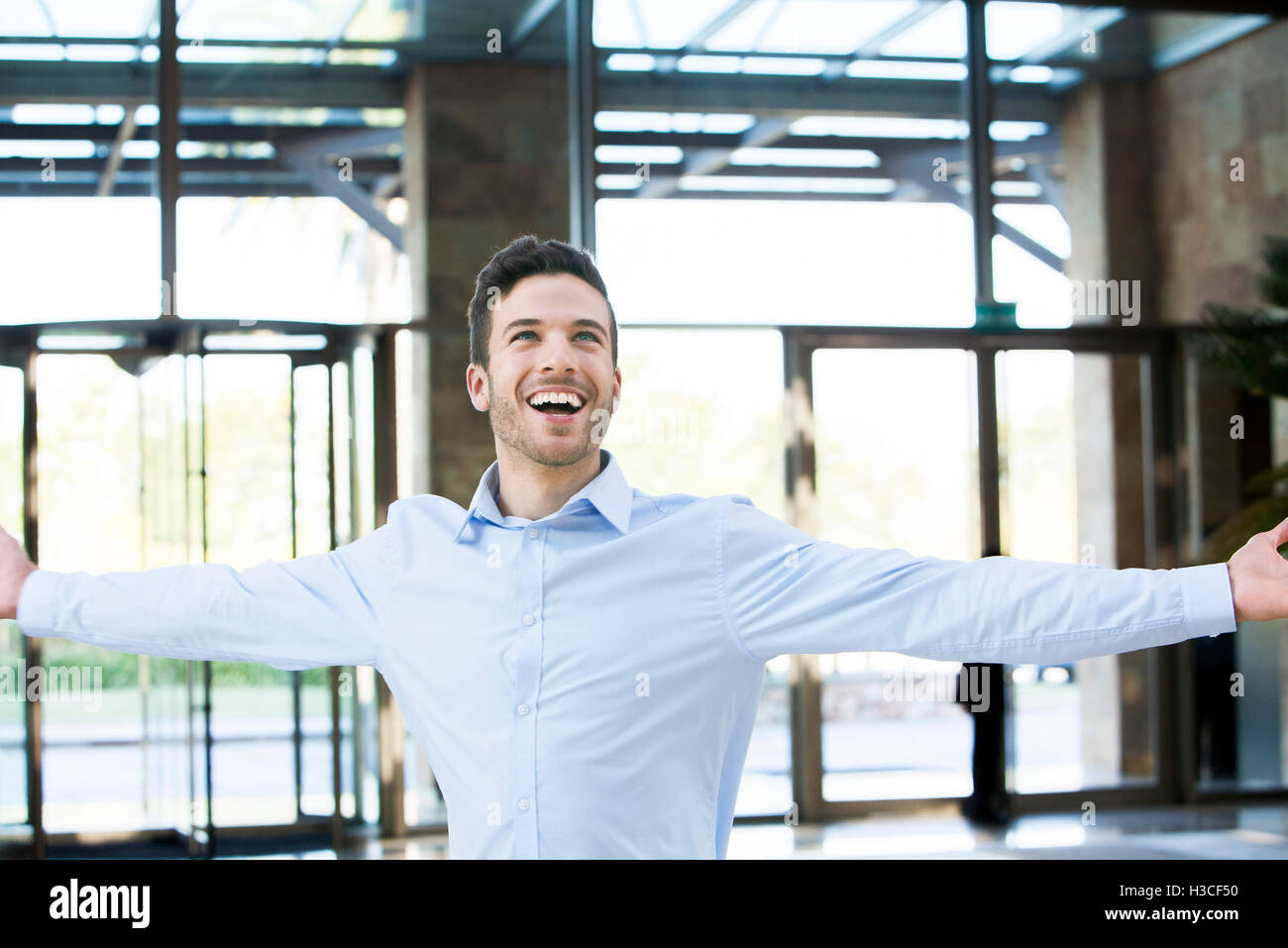 Man with arms outstretched Stock Photo - Alamy