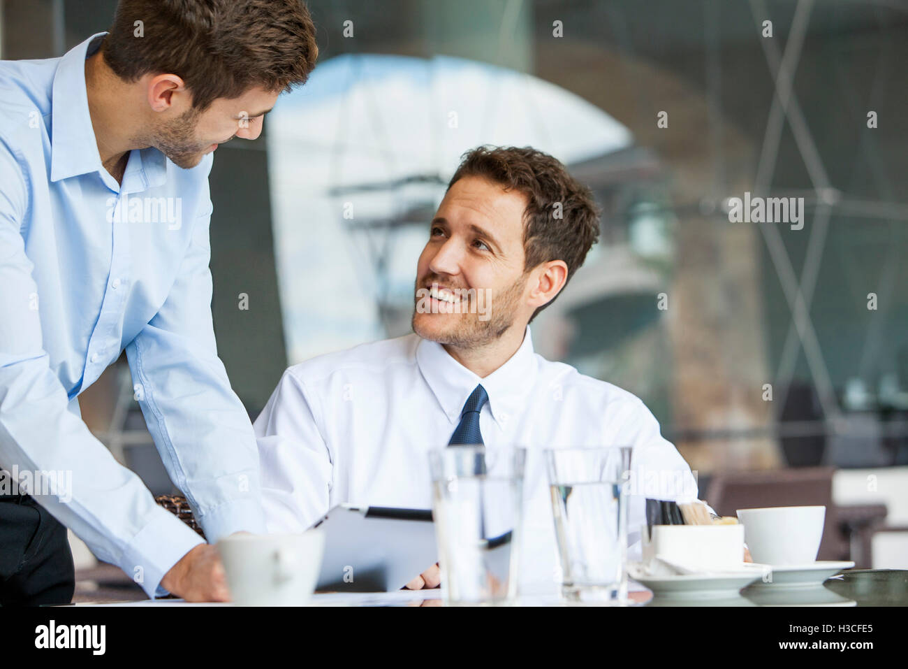 Office workers collaborating on project hi-res stock photography and ...