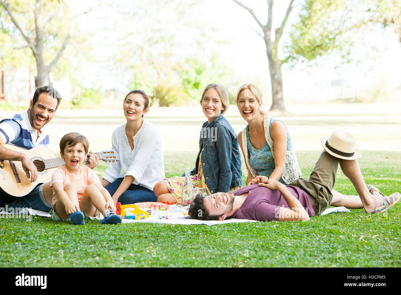Friends relaxing together in the park Stock Photo - Alamy