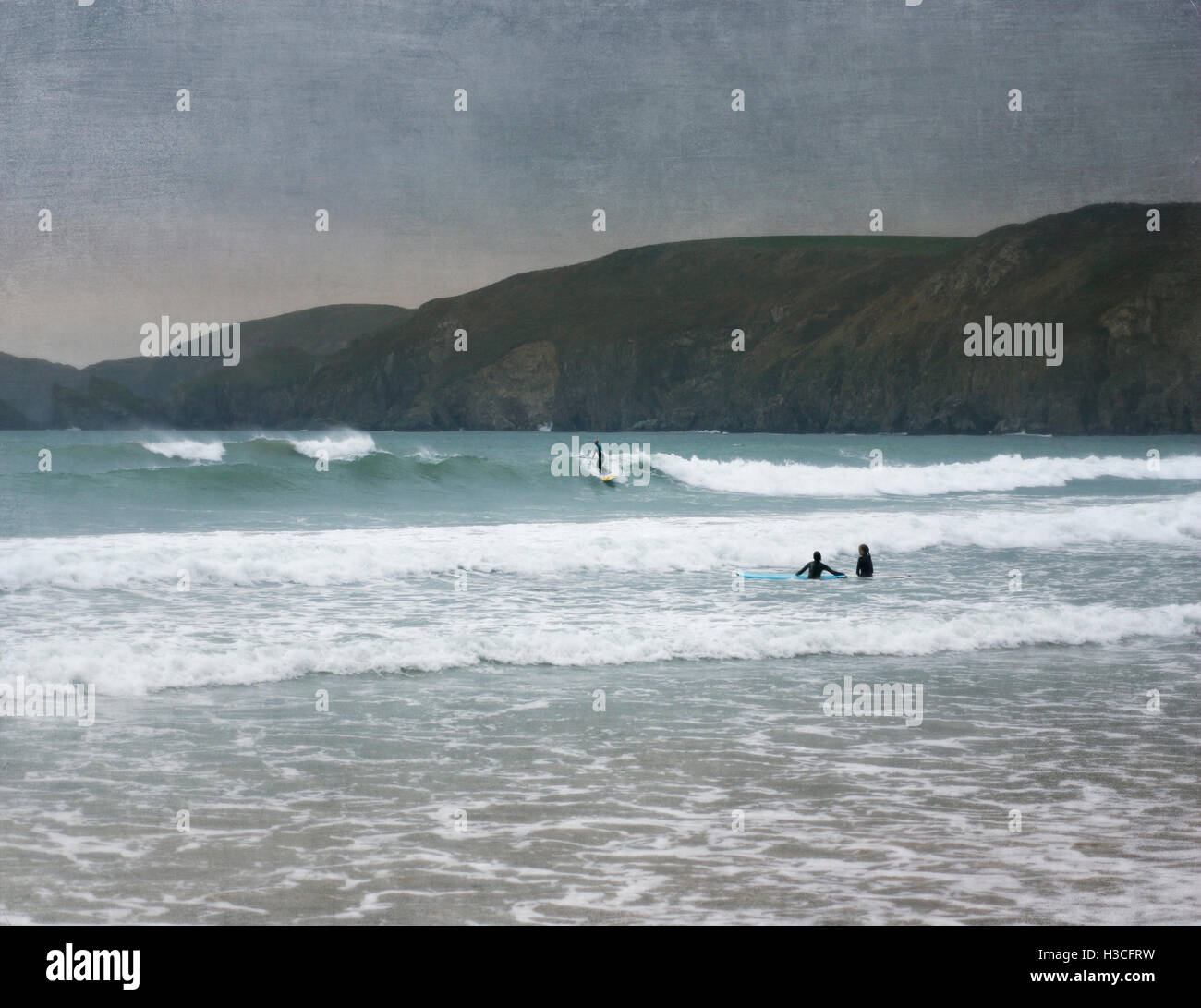 Surfers braving the rough seas in Newgale, Pembrokeshire, Wales Stock ...