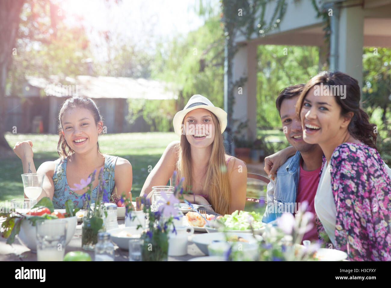 Friends bonding during weekend meal together, portrait Stock Photo - Alamy