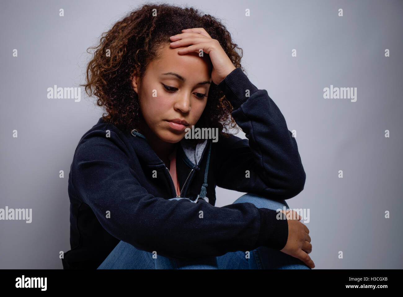 Sad afro-american woman portrait isolated on background Stock Photo - Alamy