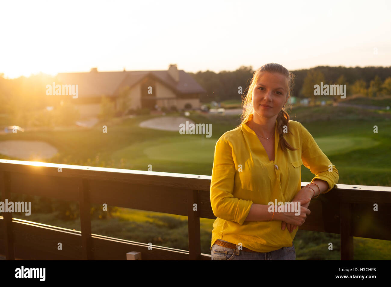 Woman standing on the terrace Stock Photo - Alamy