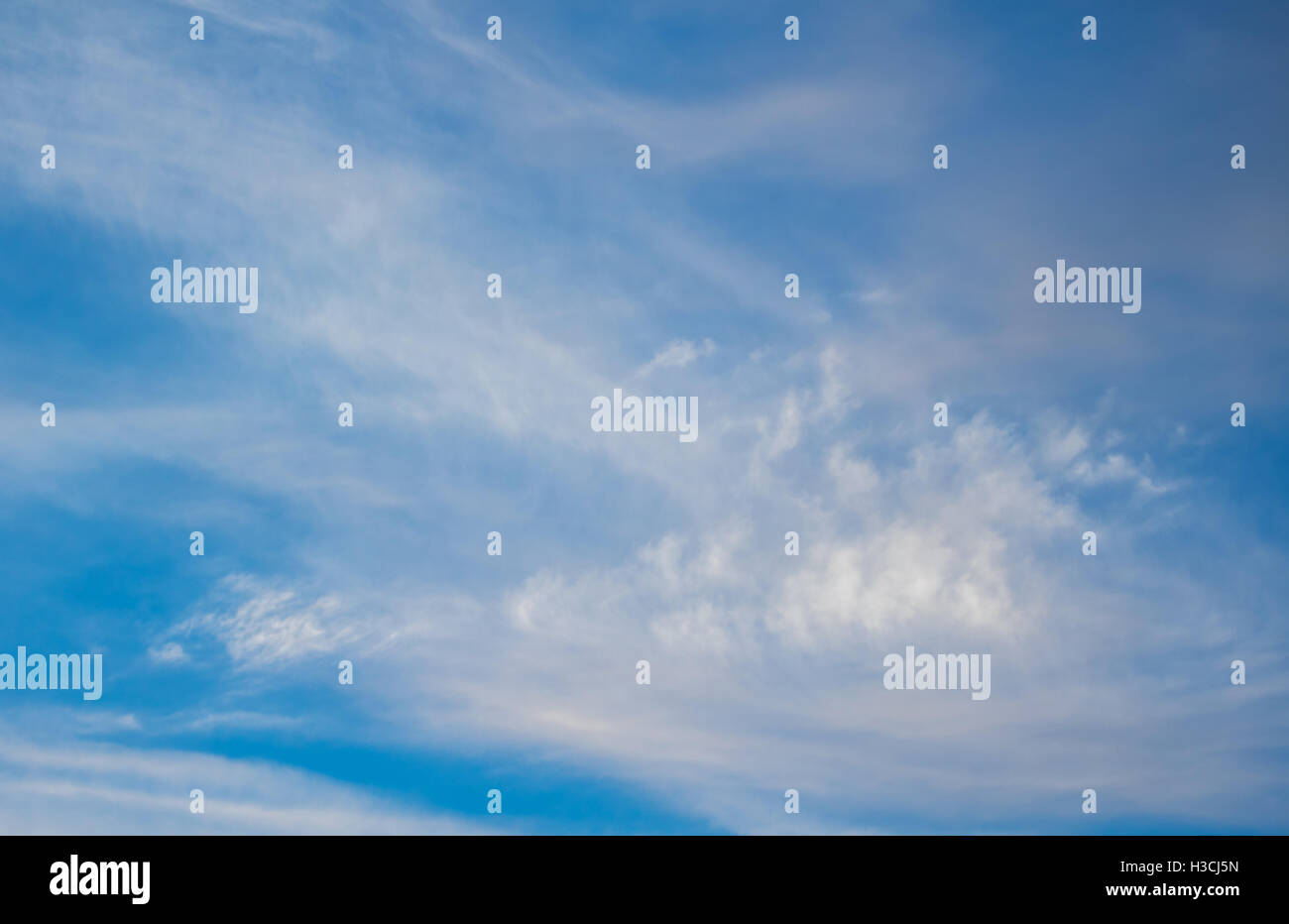 Blue boundless sky with the fluffy white clouds Stock Photo - Alamy