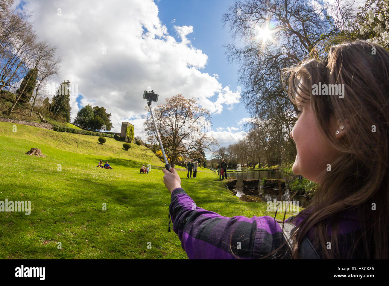 Girl using selfie stick - close up Stock Photo - Alamy