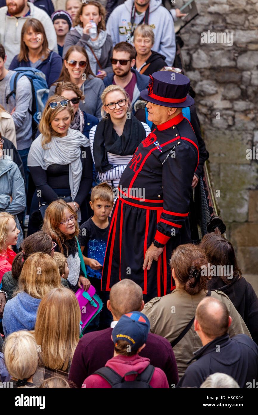 A Beefeater (Yeoman of the Guard) Giving A Tour At The Tower Of London ...