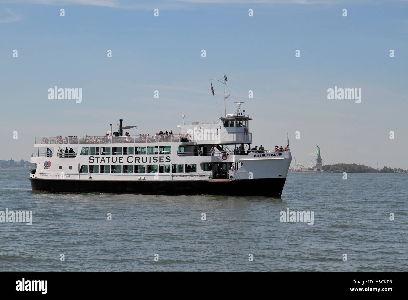 A Statue of Liberty ferry with the Statue of Liberty behind, Manhattan ...