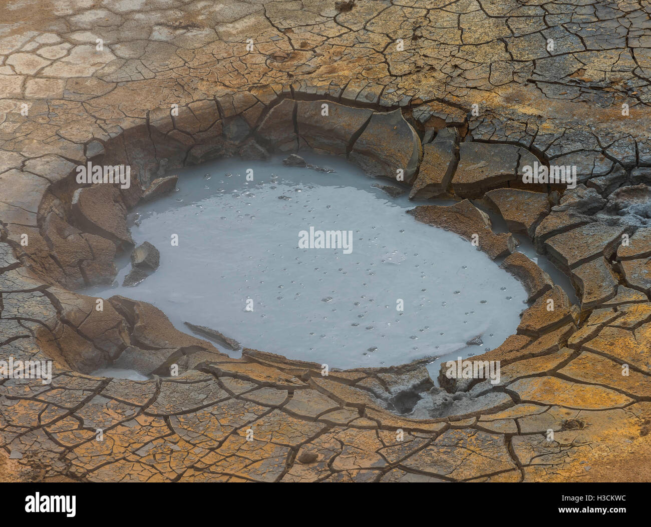 Geothermal landscape Krafla on Iceland with red dirt, a hot water pit ...