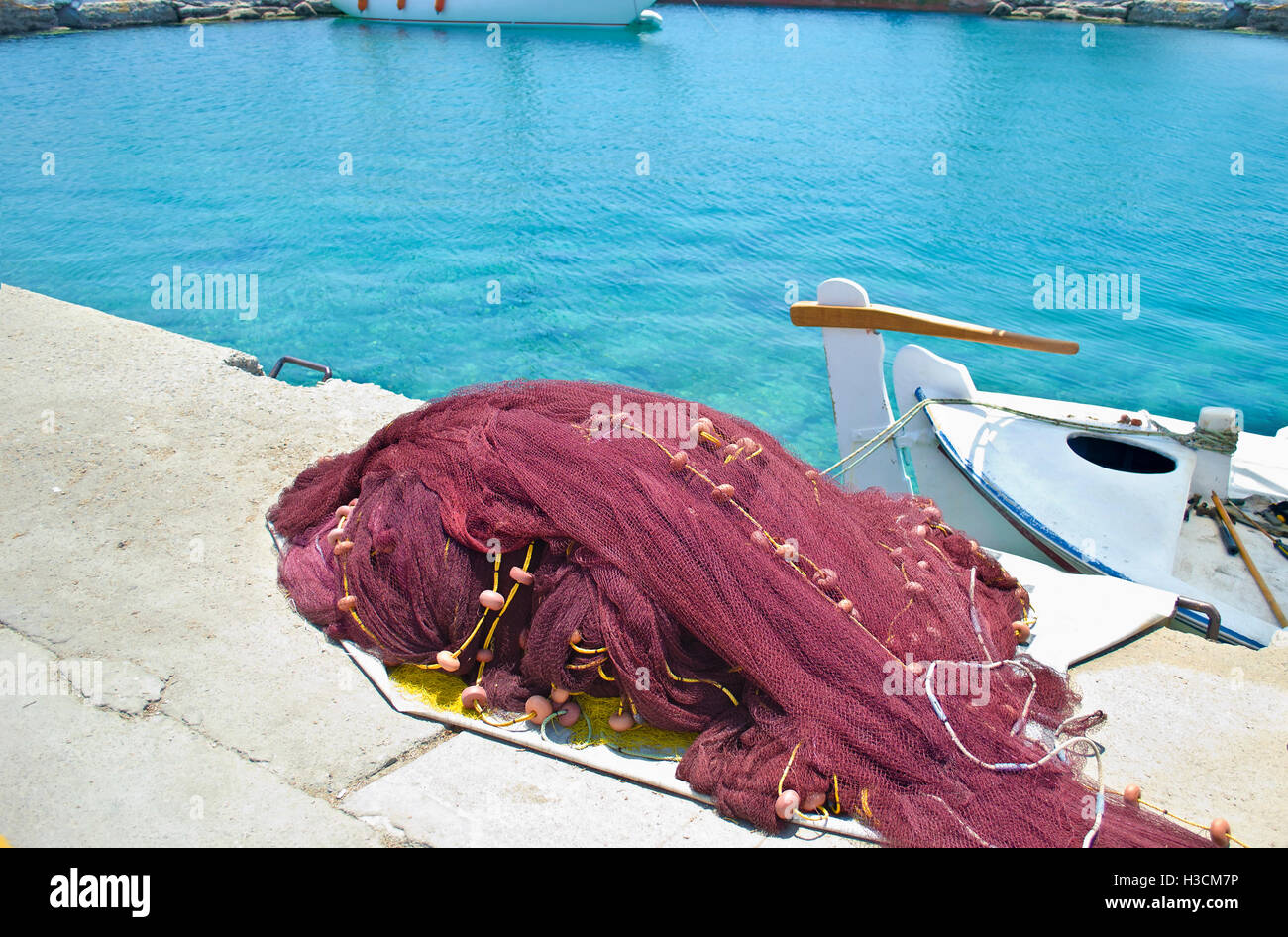 fishing nets and a boat Aegean island Greece Stock Photo - Alamy