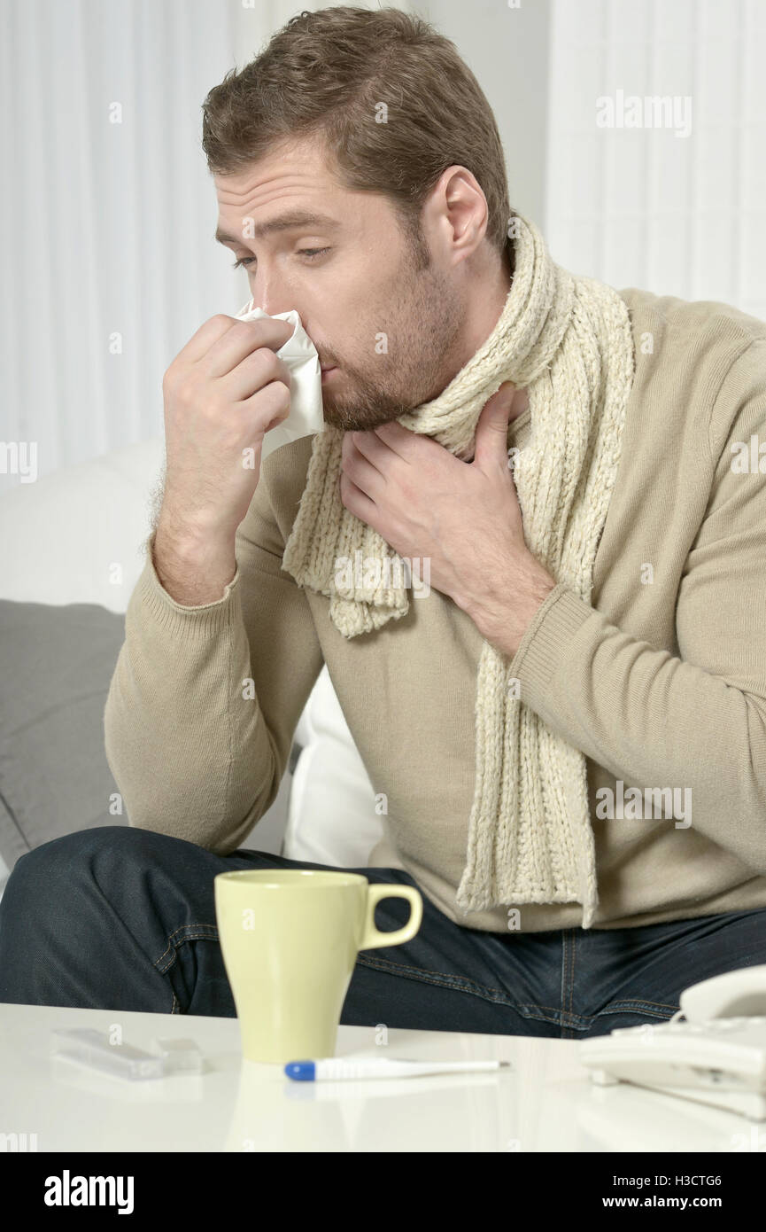 Sick man drinking warm hi-res stock photography and images - Alamy