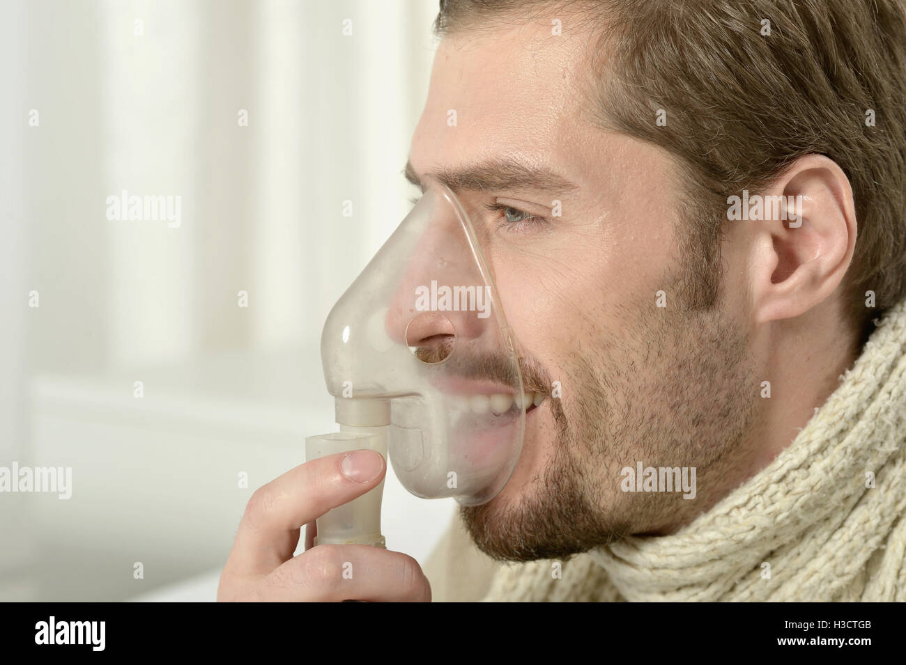 Man Inhaling Through Inhaler Mask Stock Photo - Alamy