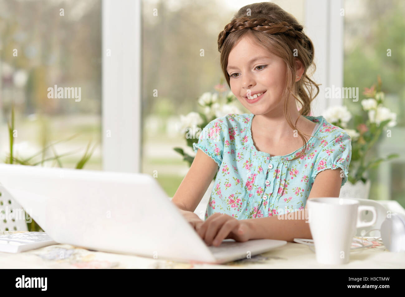 Little girl using computer Stock Photo - Alamy