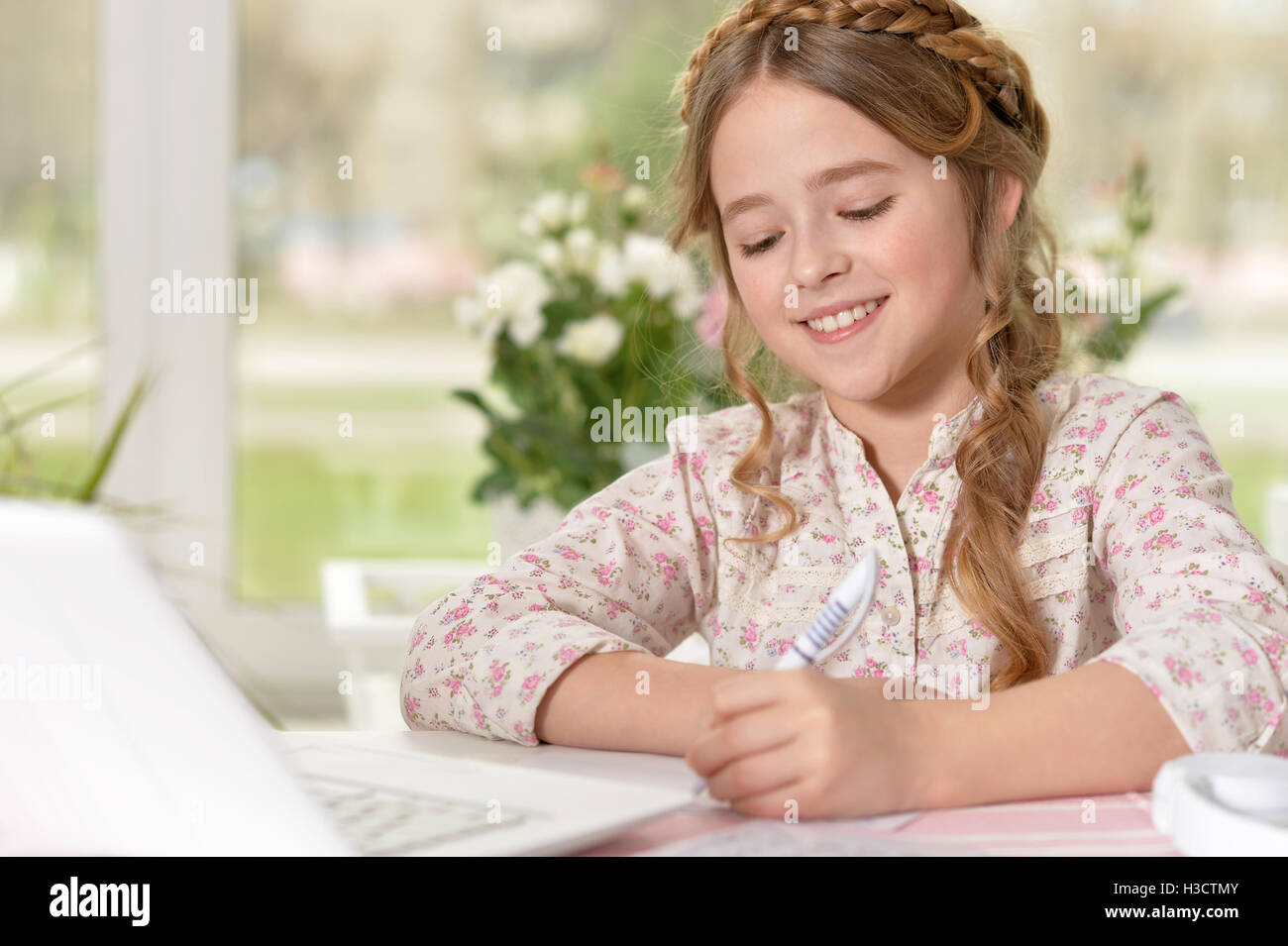 Little girl using computer Stock Photo - Alamy