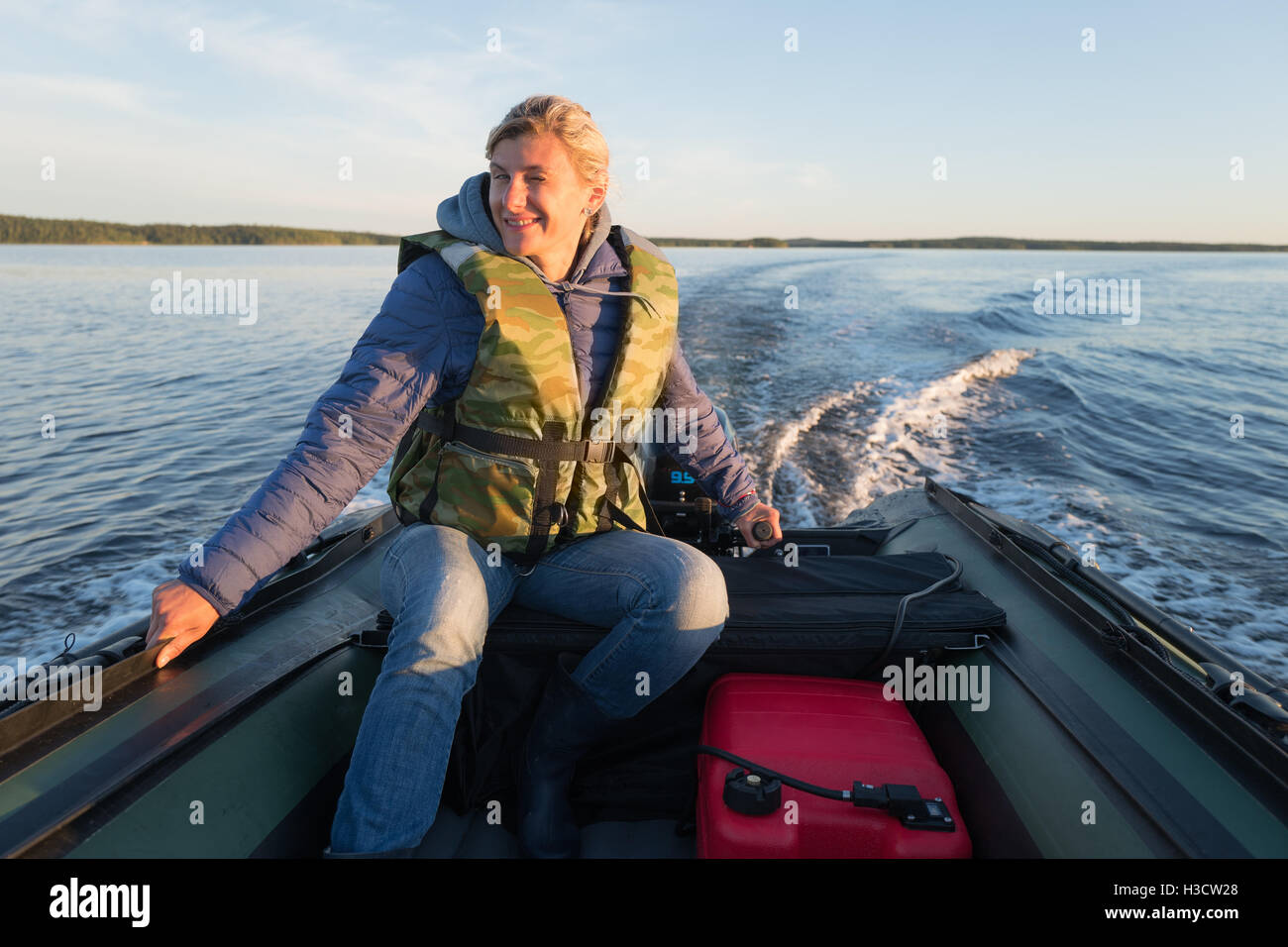 Smiling blonde boat hi-res stock photography and images - Alamy