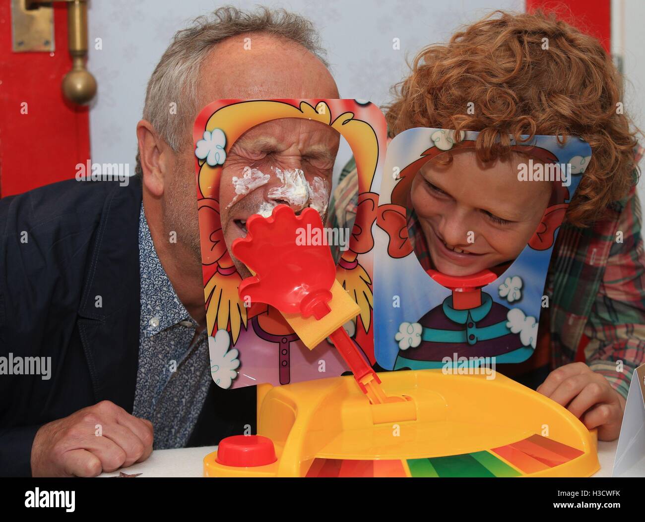 Alan Twigg (left) plays Pie Face Showdown with his son Archie, 11, at ...