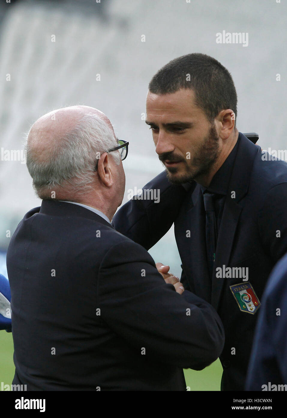 Turin, Italy. 05th Oct, 2016. ItalyÕs Leonardo Bonucci, right, talks to ...