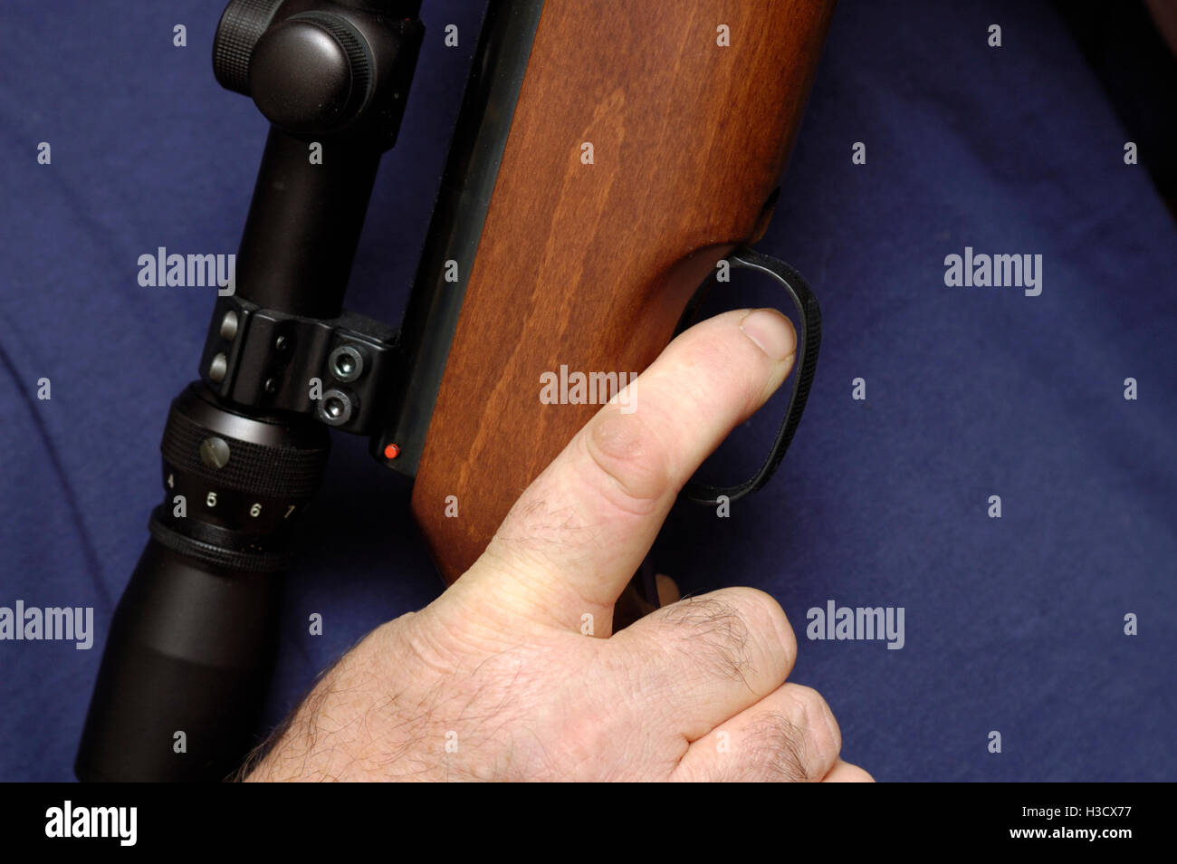 Man with Finger on Rifle Trigger Stock Photo - Alamy