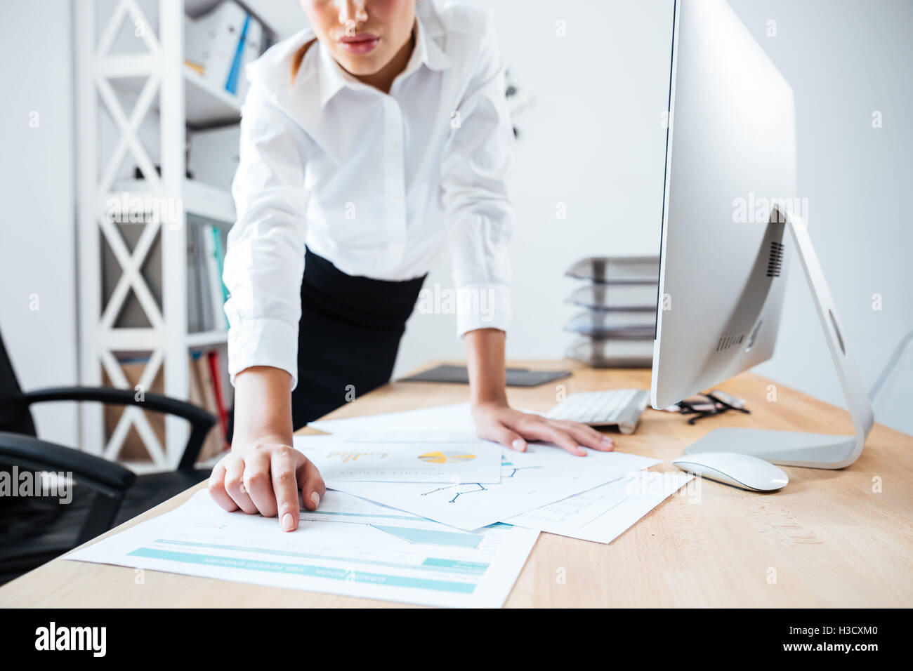 Woman pointing finger in office hi-res stock photography and images - Alamy