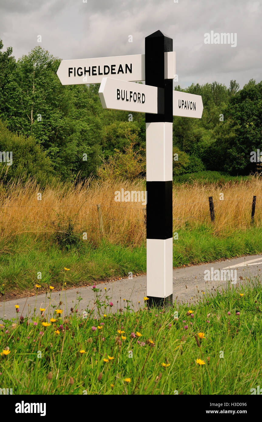 A black and white signpost on a minor road Stock Photo - Alamy