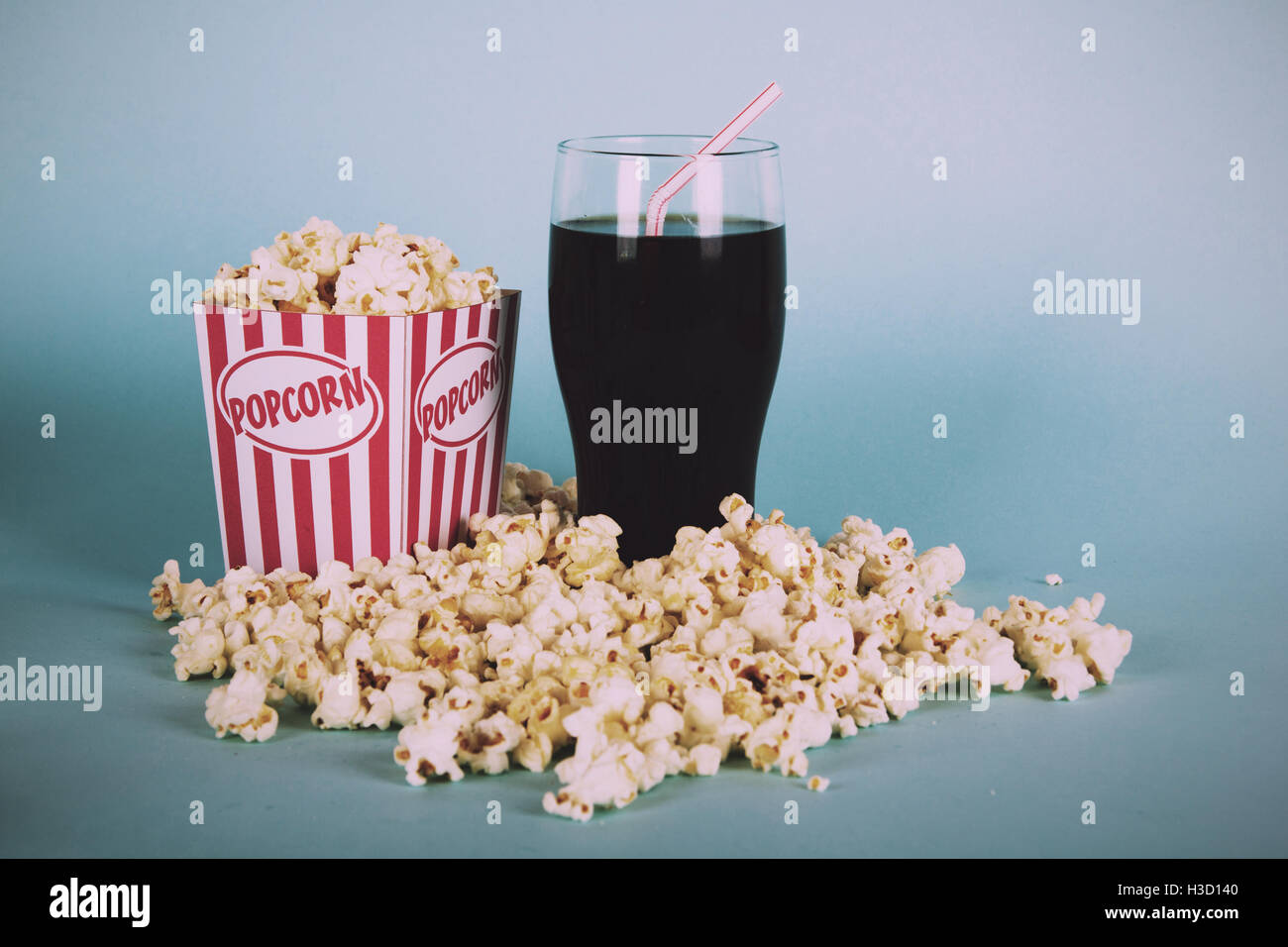 Bucket of popcorn against a blue background Vintage Retro Filter Stock ...