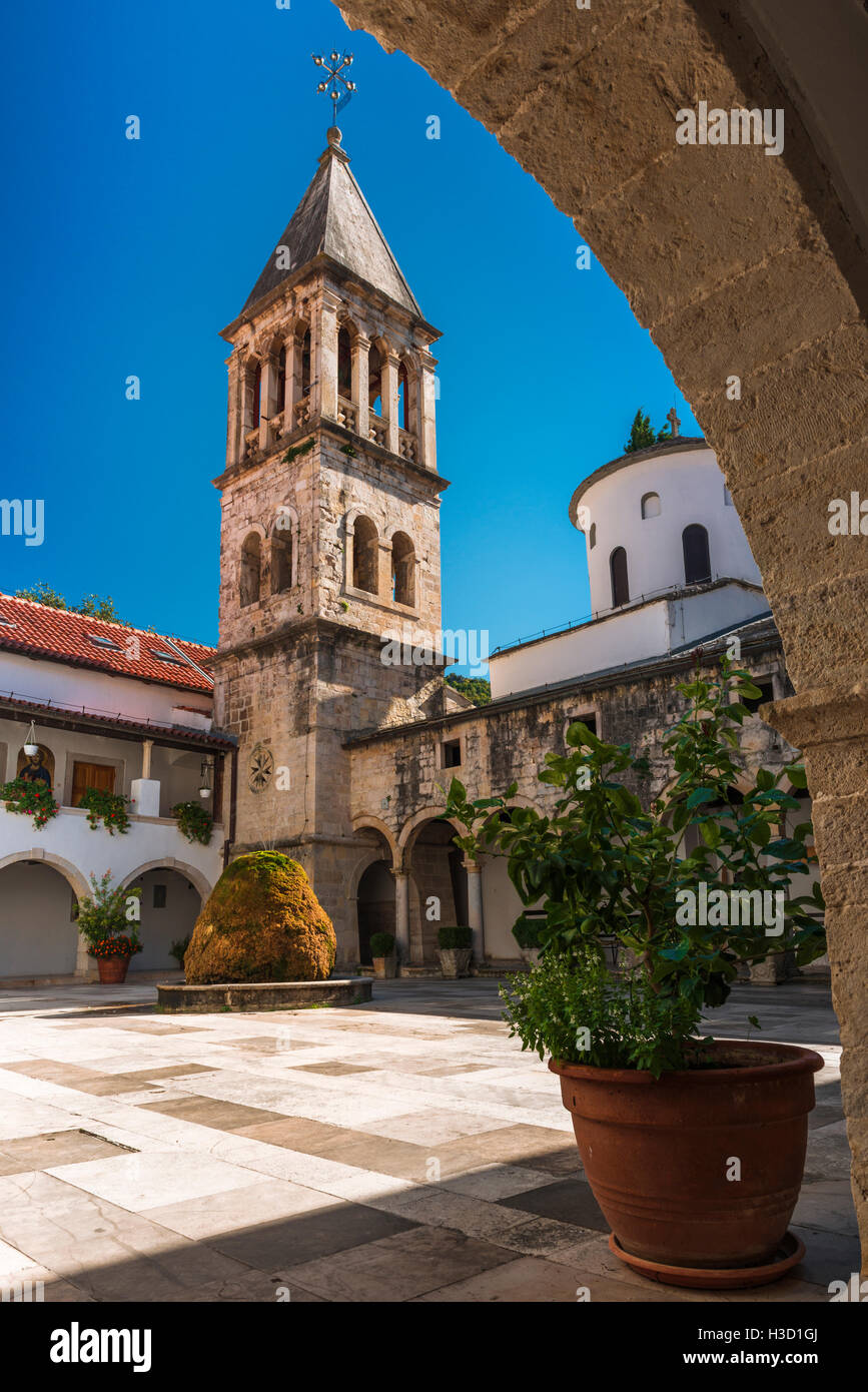 The abbey bell tower and courtyard, Krka Monastery, Krka National Park ...
