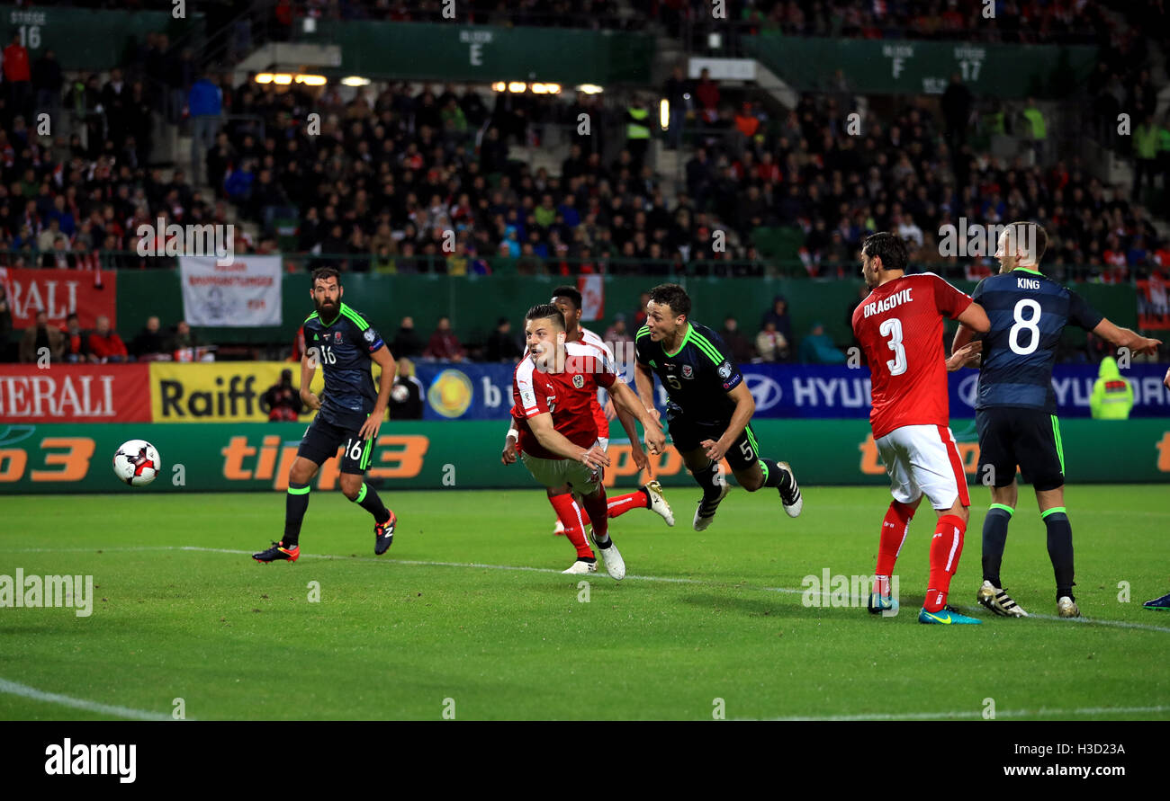 Austria's Kevin Wimmer (red mid air) scores an own goal for Wales ...