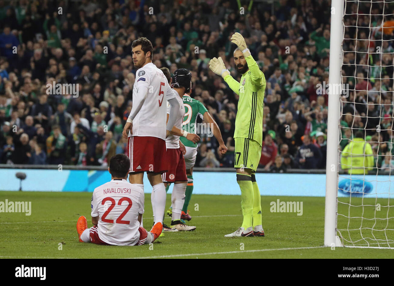 Georgia's Giorgi Loria (right) reacts after Republic of Ireland's ...
