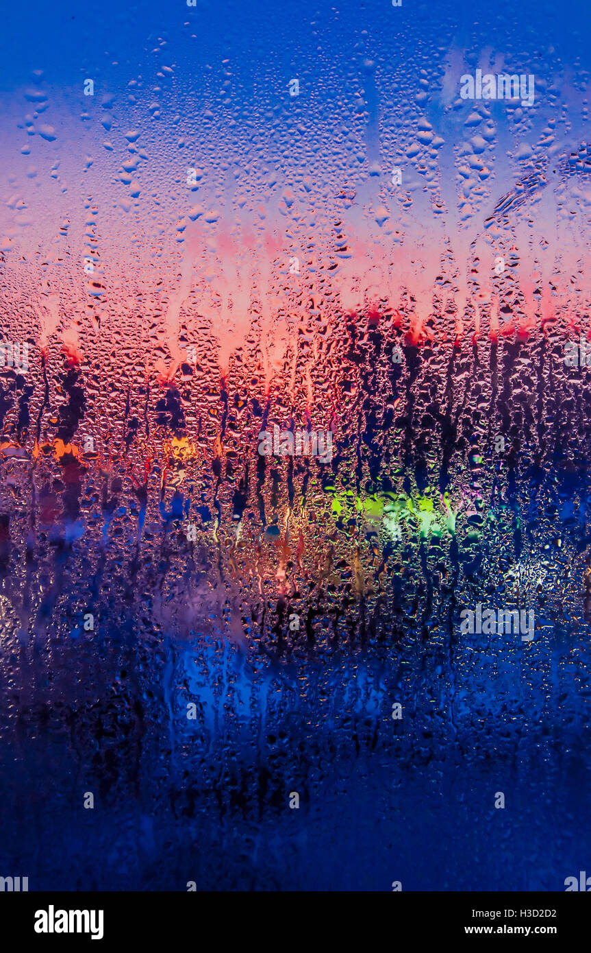 Abstraction. Dawn through wet glass. Texture Stock Photo - Alamy